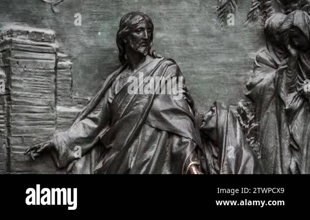 Beautiful Duomo di Milano iron gates decor in close up.Jesus Christ ...