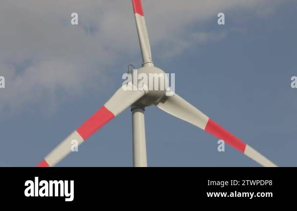 Wind turbine close-up against the background of clouds floating in the ...