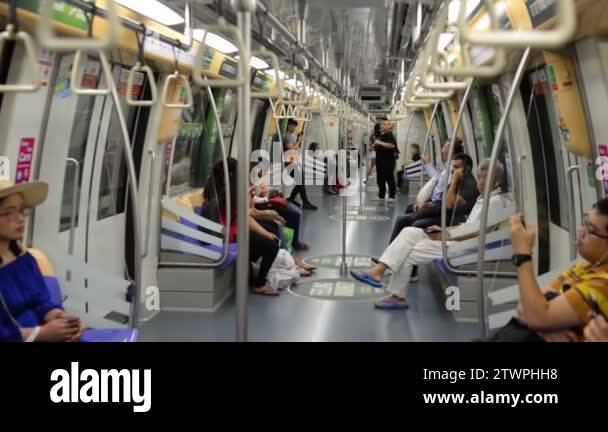 Singapore, Singapore - May 8, 2018 : People ride in a MRT train. Mass ...
