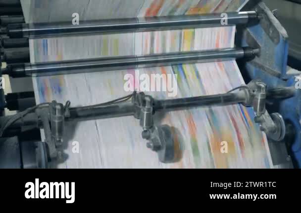 Printing newspapers in typography. Rapid motion of coloured paper ...