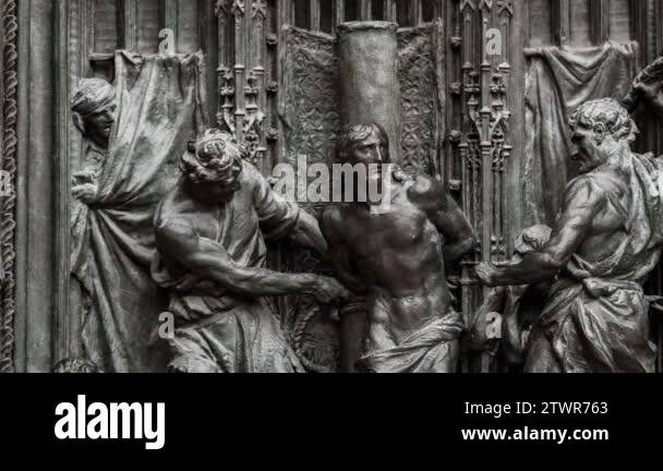 Beautiful Duomo di Milano iron gates decor in close up.Jesus Christ ...