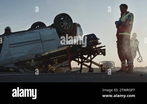 Sad, Sorrowful Paramedic Standing at the Scene of the Terrible Car ...