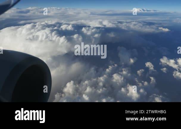 Aerial shot of a blanket of white and fluffy clouds from a plane`s window A stunning view from ...