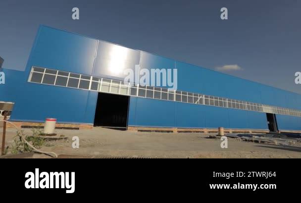 Construction of a modern factory or warehouse. The building of a large ...