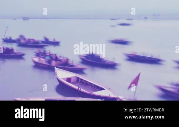 Indian pilgrims rowing boat in dawn, Ganges river in Varanasi, India ...