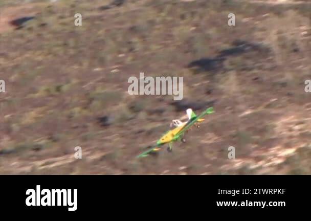 Fire fighting plane spraying fire extinguisher on burning forest, Mount ...