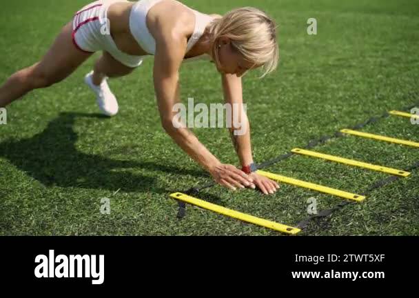 Sporty girl doing exercises on the agility ladder Stock Video Footage ...