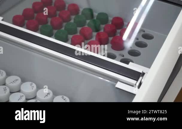 Test tubes and bottles arranged on medical trolley. Clip. Rack of test ...