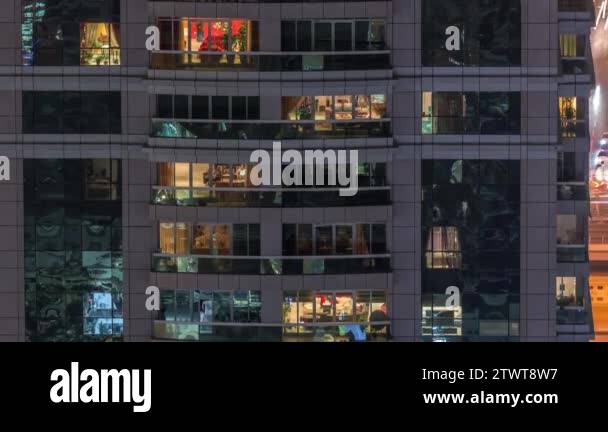 Night view of exterior apartment building timelapse. High rise ...