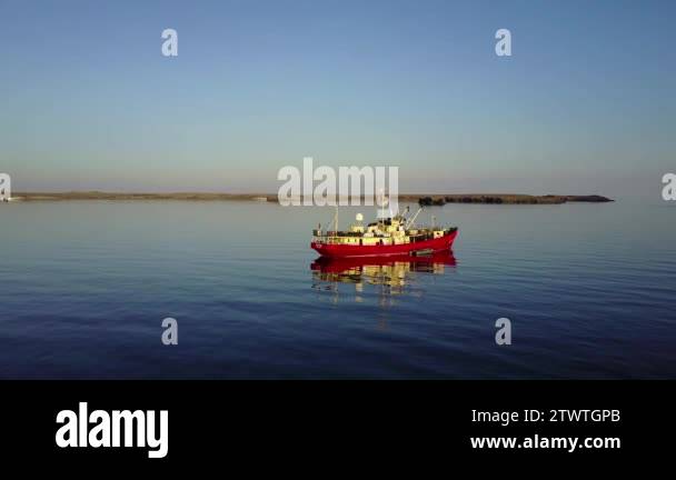 Expedition research vessel bright red color in Ocean on New Earth ...