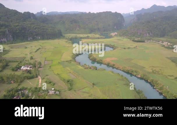 pictorial calm blue river reflects trees near green fields Stock Video ...
