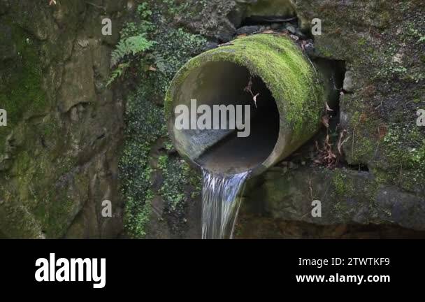 An old sewer pipe through which the rainwater flows. A large pipe is ...