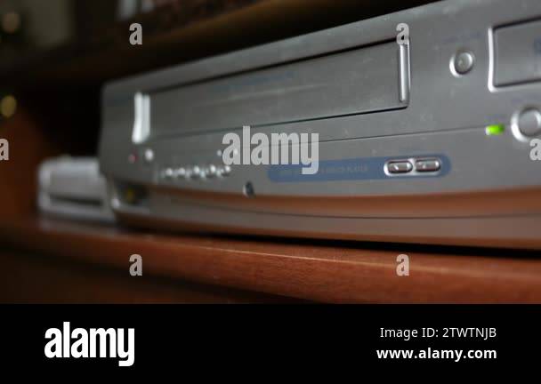 Removing a VHS Tape into VHS player - Pushing stop then ejecting Stock ...