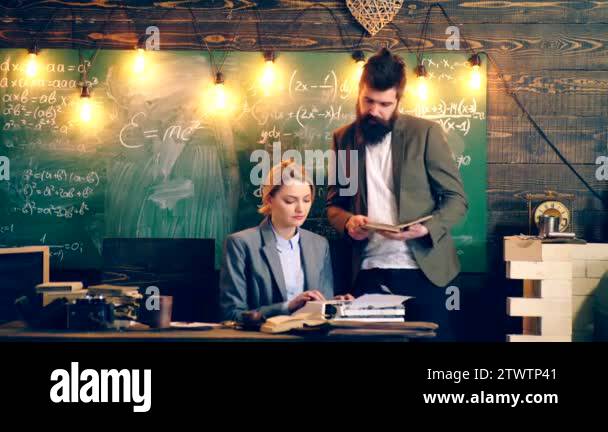 Teachers type the text on a typewriter for dictation from the book ...