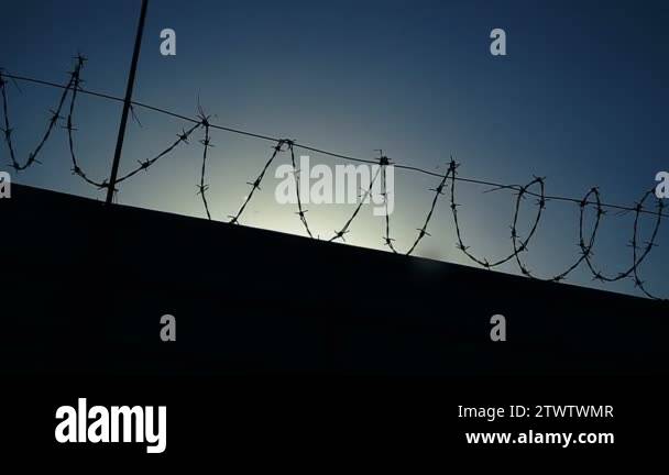 Barbed wire on light Stock Videos & Footage - HD and 4K Video Clips - Alamy