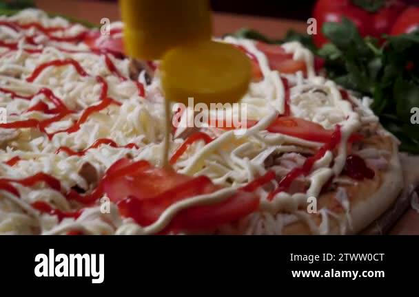 Hands preparing a pizza. Frame. Cook in the kitchen putting the ...