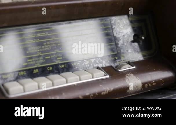 Close up of an old radio receiver with rubbing and white buttons, retro ...