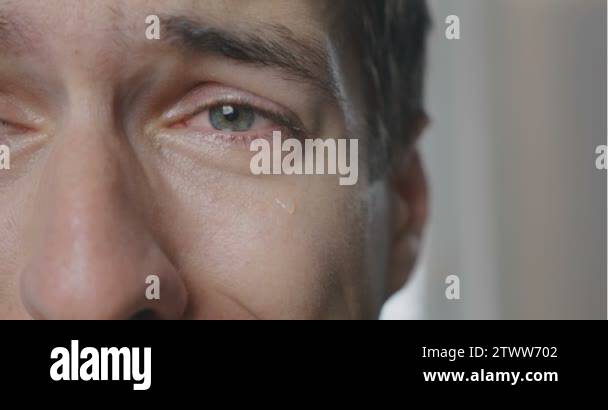 Close up of Sad man crying with tears in eyes. Tear running down his ...