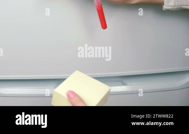 Closeup womans hands stick yellow sticker paper sheets with words dont ...