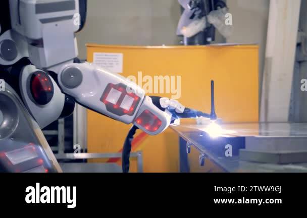 Human-like robot starts welding process of a metal sheet Stock Video ...