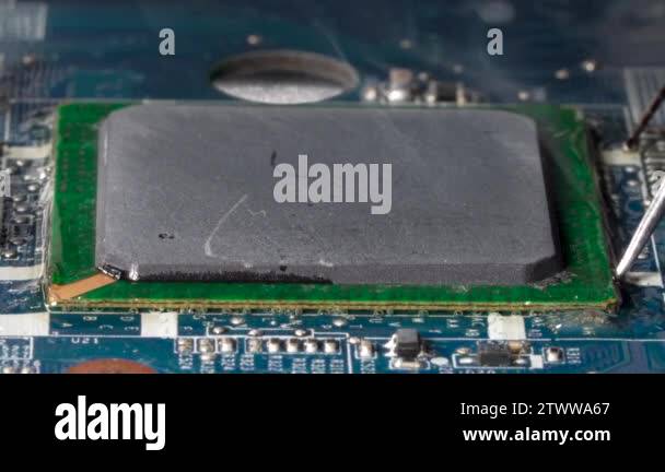Boiling flux paste around the grid array microchip. Checking ...