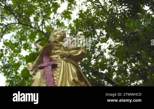 Golden statue ancient eastern warrior. Close up sculpture samurai with ...