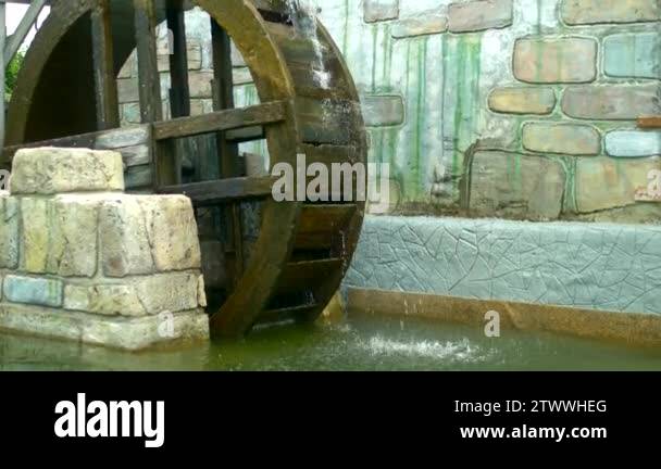 water Mill. close-up. the details. the wooden wheel of the mill rotates ...