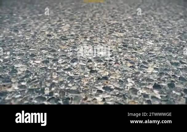 Structure of the asphalt, road marking. Close-up of animated road for ...