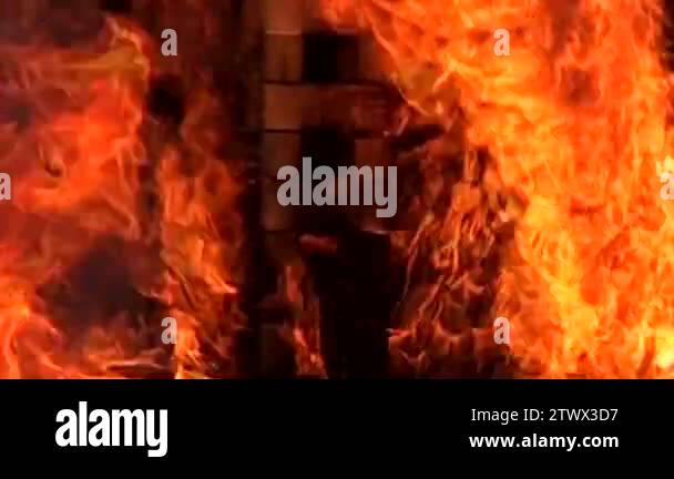 Bright and dangerous fire. Flames of fire and black smoke. Strong fire ...