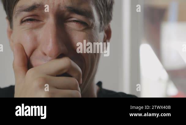 Close up of Sad man crying with tears in eyes. Tear running down his ...