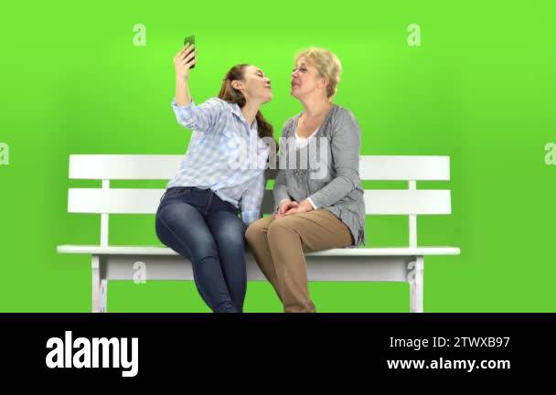 Mom and daughter do selfie. Green screen Stock Video Footage - Alamy