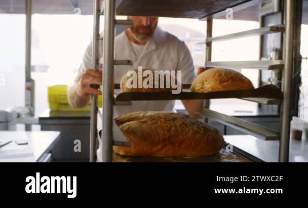 Male chef pushing bakery trolley in commercial kitchen 4k Stock Video ...