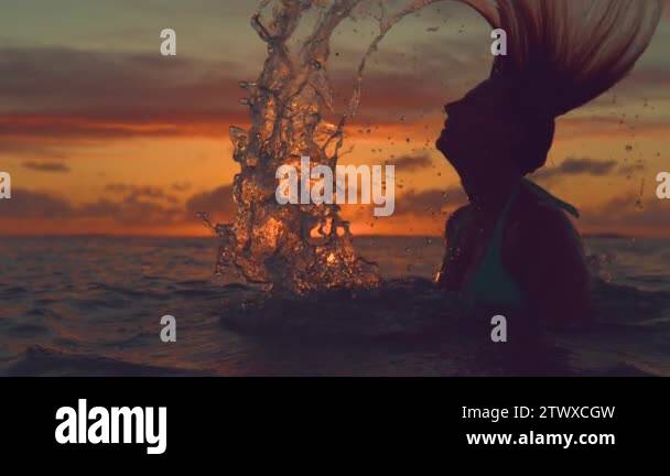 SLOW MOTION, CLOSE UP, SILHOUETTE: Playful female tourist cools off in ...