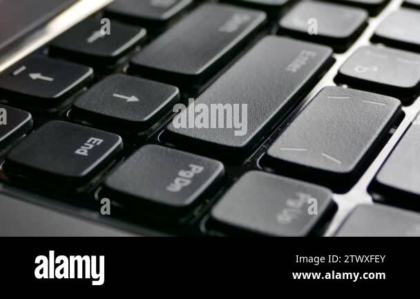 Press the buttons on the laptop keyboard. Work on computer. Type text ...