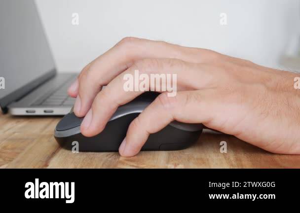 Hand using wireless mouse with laptop, personal computer use for office work. Closeup. 4k Stock ...