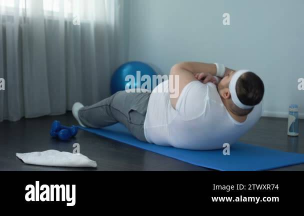 Sit ups on mat Stock Videos & Footage - HD and 4K Video Clips - Alamy