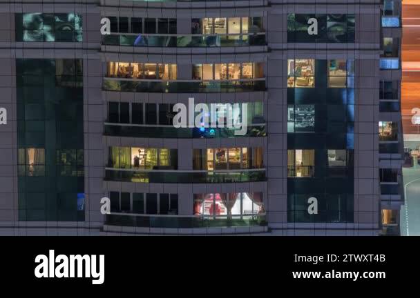 Night view of exterior apartment building timelapse. High rise ...