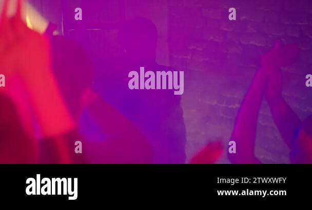 Clap Your Hands! Put your hands in the air! Friends having fun at a ...