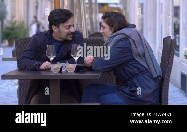 angry woman giving slap to her boyfriend during aperitif, and going ...