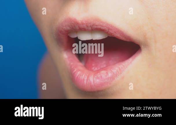 close-up, female lips without makeup, on a blue background. 4k, slow ...