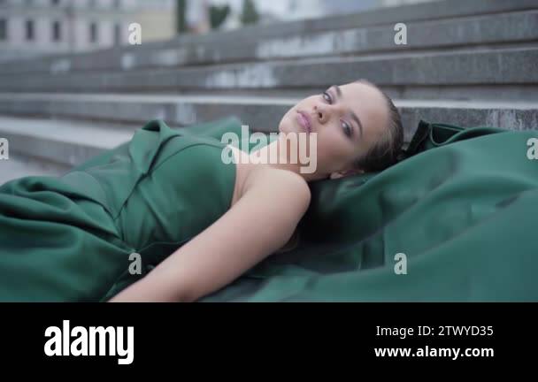 Portrait Cute Young Girl In A Stunning Evening Green Dress Lying On