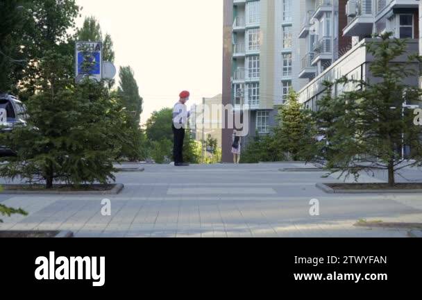 Young man mime playing small funny scenes on camera at blurred ...