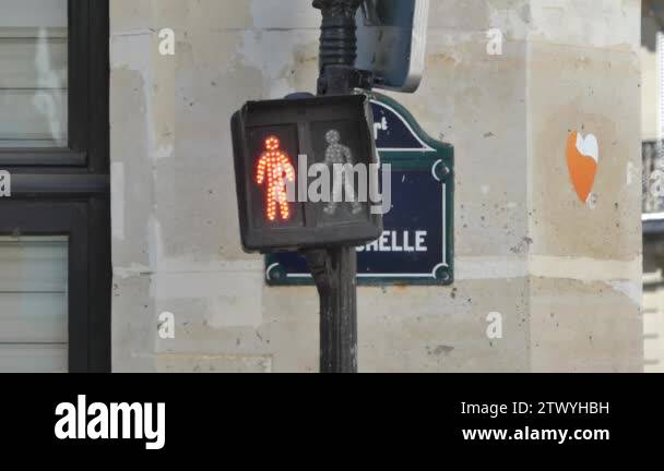 Paris, France - May 2019: Red (Green) traffic light for a pedestrian. A ...