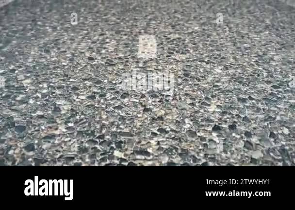 Structure of the asphalt, road marking. Close-up of animated road for ...