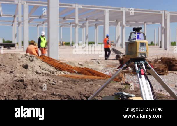 Total center device on tripod with laser for leveling other devices to ...