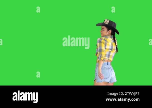 Cowboy Girl Dances Walking On A Green Screen Chroma Key Stock Video
