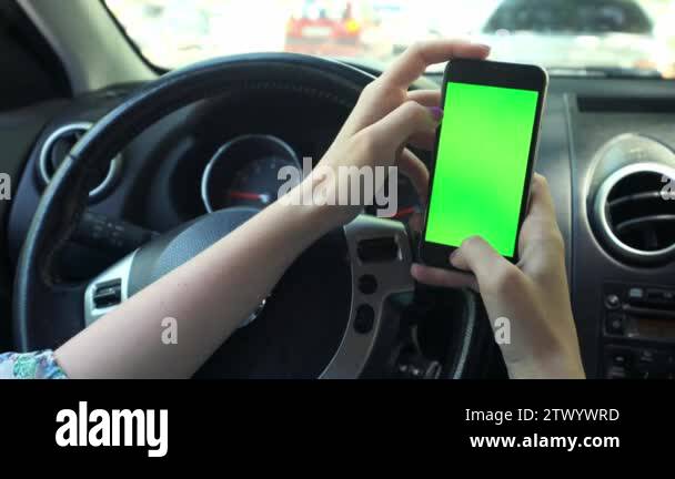 Girl Driver closeup, greenscreen in the car, urban city background ...