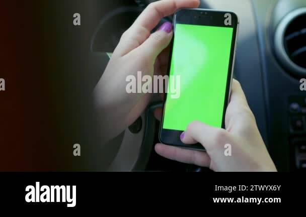 Girl Driver closeup, greenscreen in the car, urban city background ...