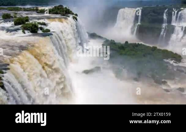 Time lapse with view of Iguazu Falls showing the grand scale and ...