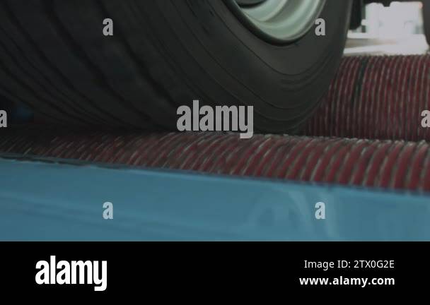 Checking the brake system of the car using the rollers at the service ...